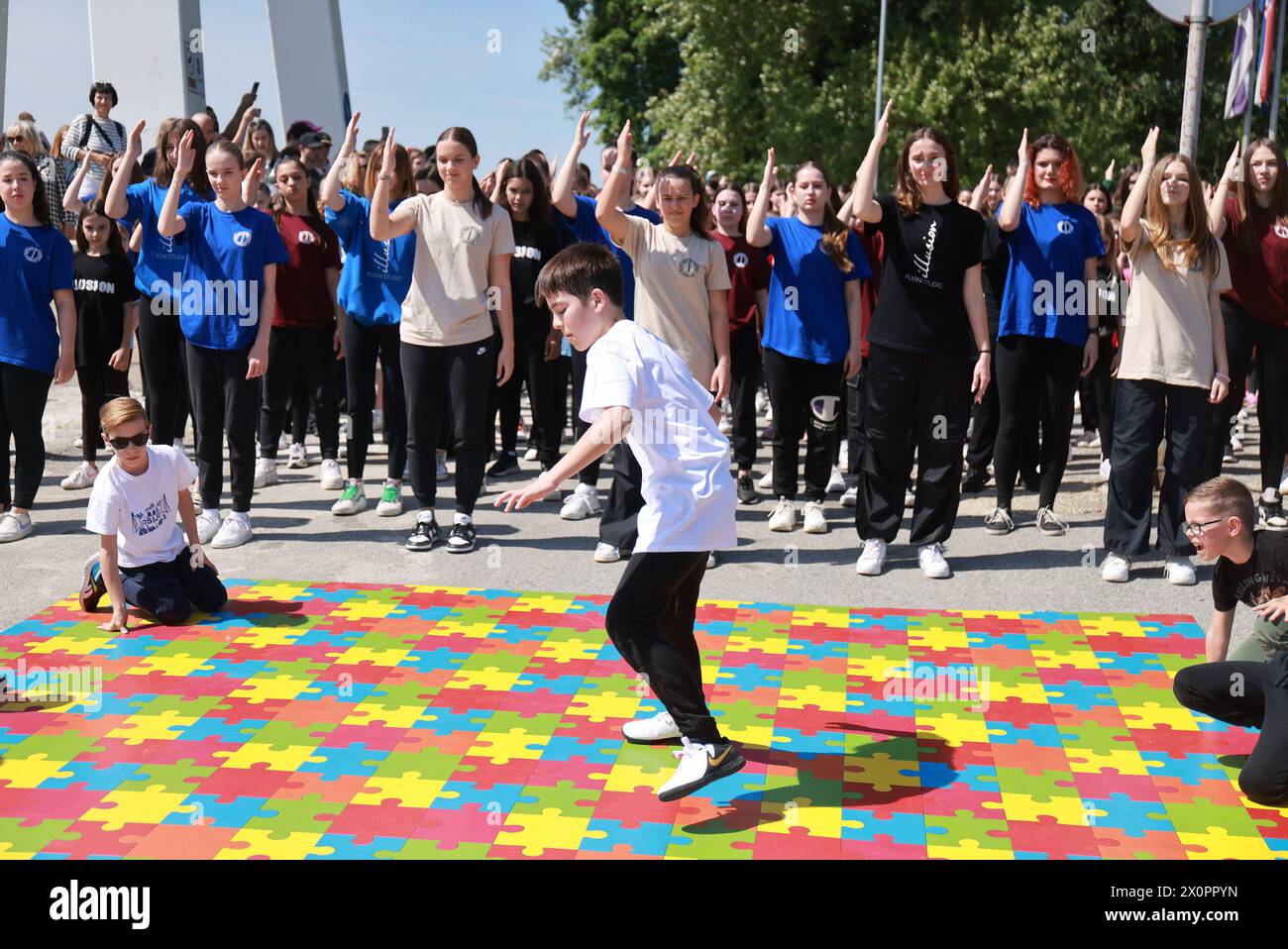People dance in the rhythm of Rim Tim Tagi Dim song to show support to ...
