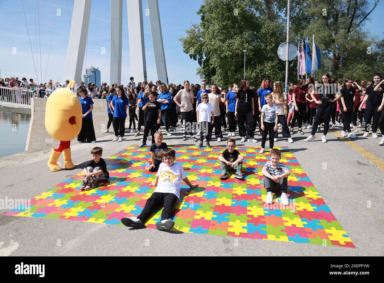 People dance in the rhythm of Rim Tim Tagi Dim song to show support to ...