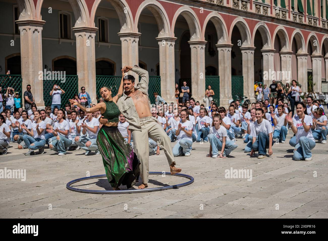 People dance in the rhythm of Rim Tim Tagi Dim song to show support to ...