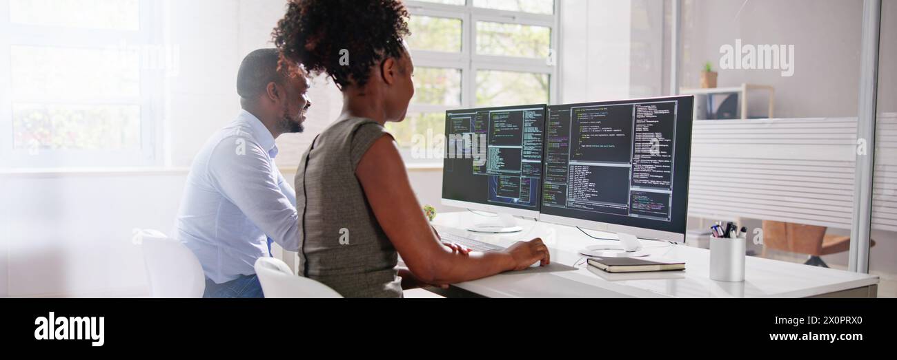 African American woman training on computer monitor Stock Photo - Alamy