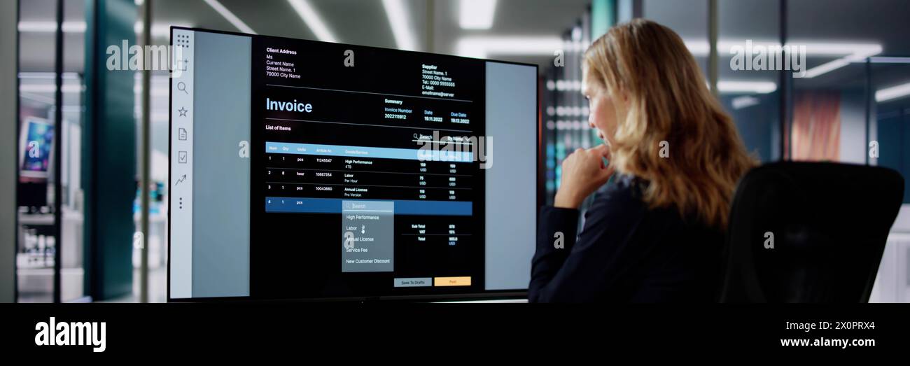 Accountant using computer software to create invoice on desktop Stock ...