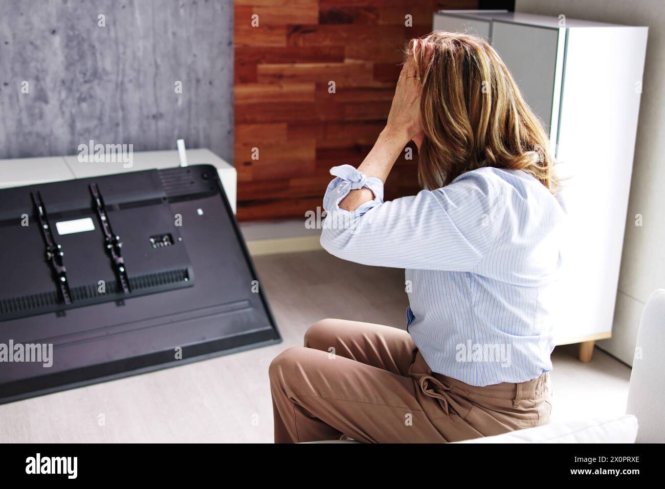 Broken television screen falling from wall during fall Stock Photo - Alamy