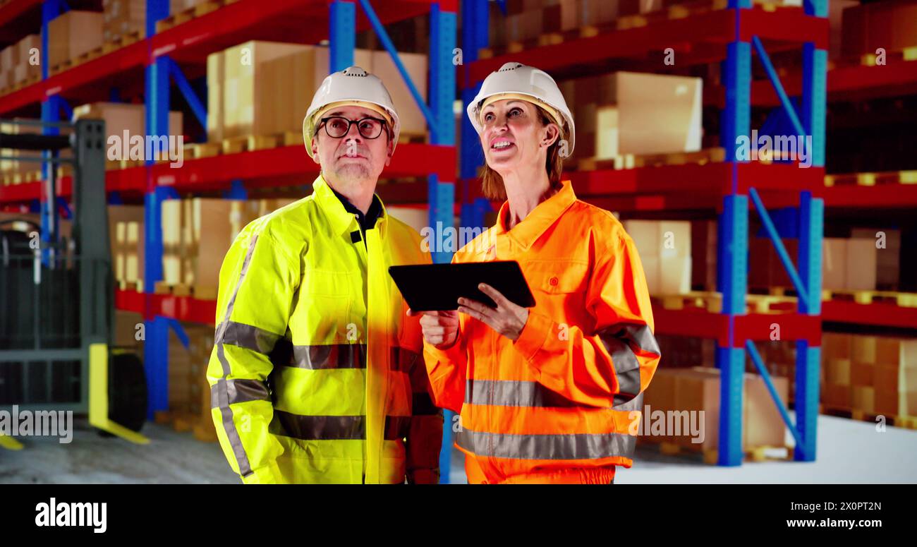 Inspecting boxes warehouse staff hi-res stock photography and images ...