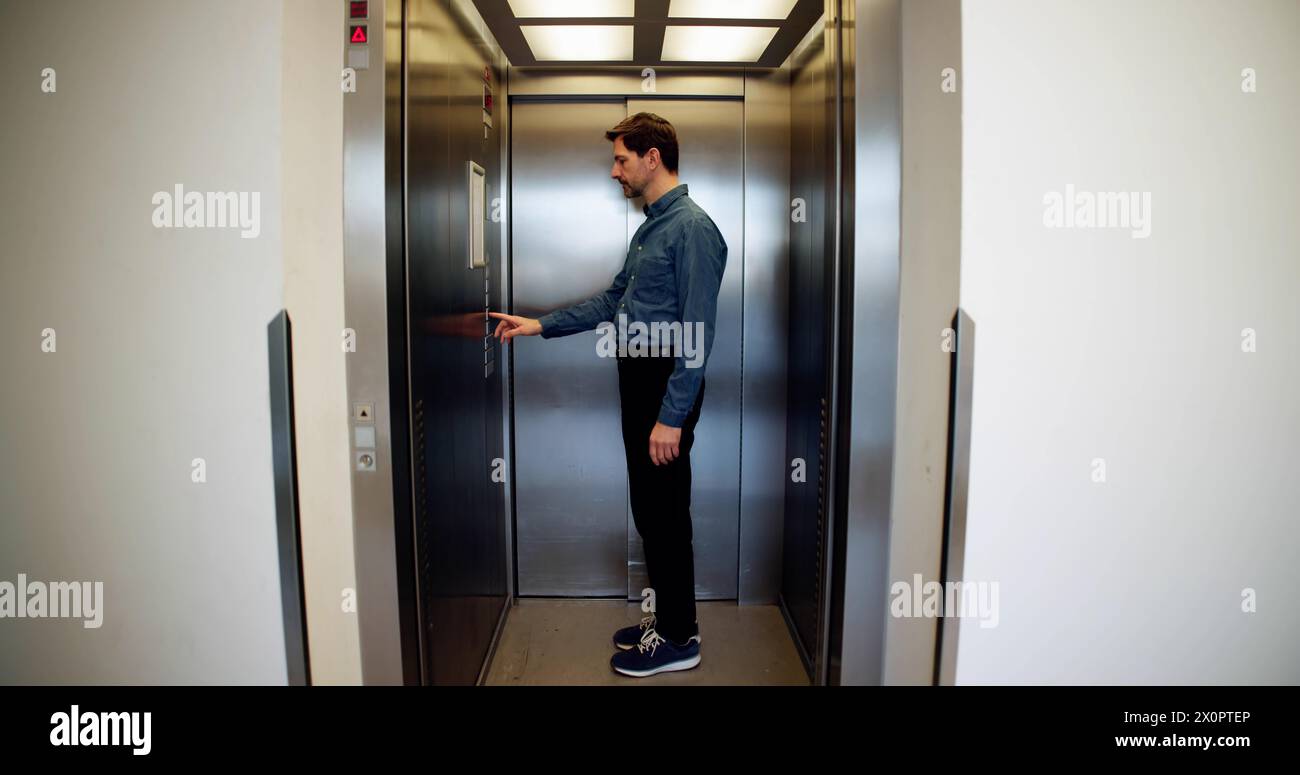 Holding the elevator door hi-res stock photography and images - Alamy