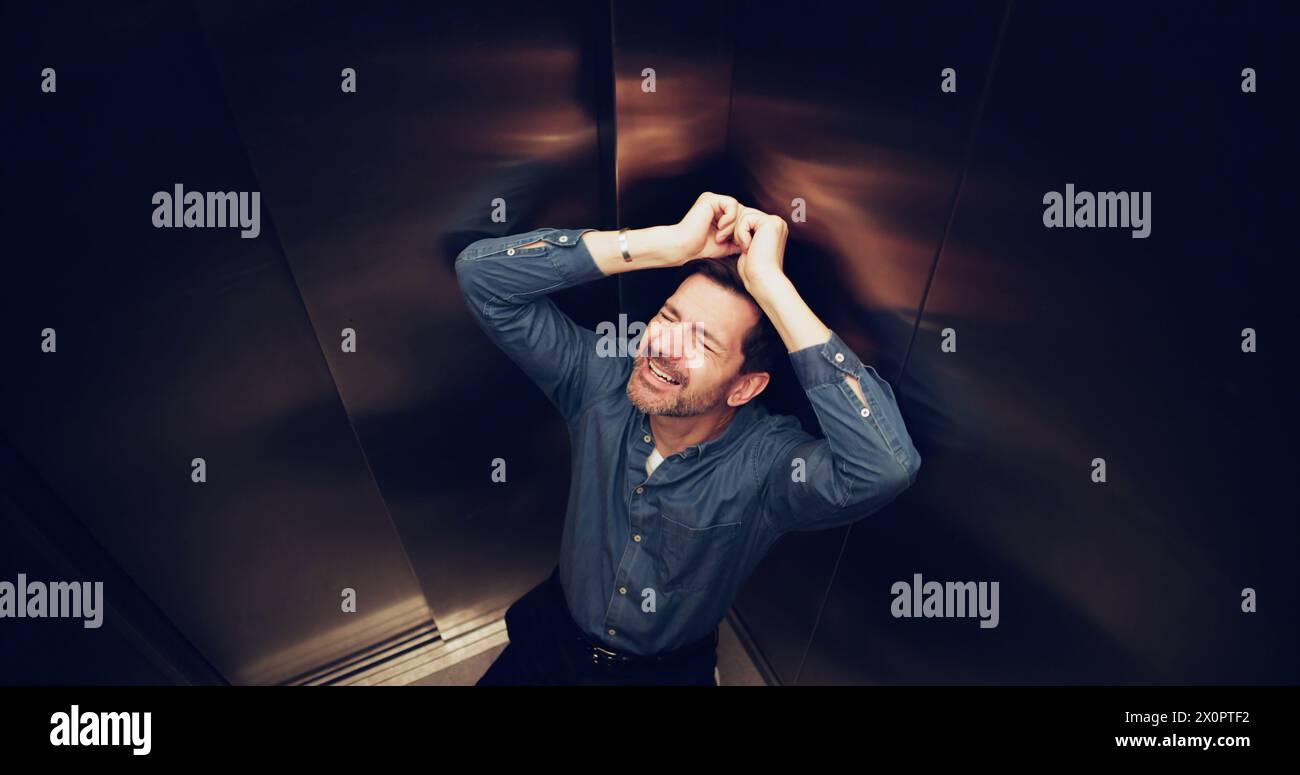 Man Suffering From Claustrophobia Trapped Inside Elevator Stock Photo ...