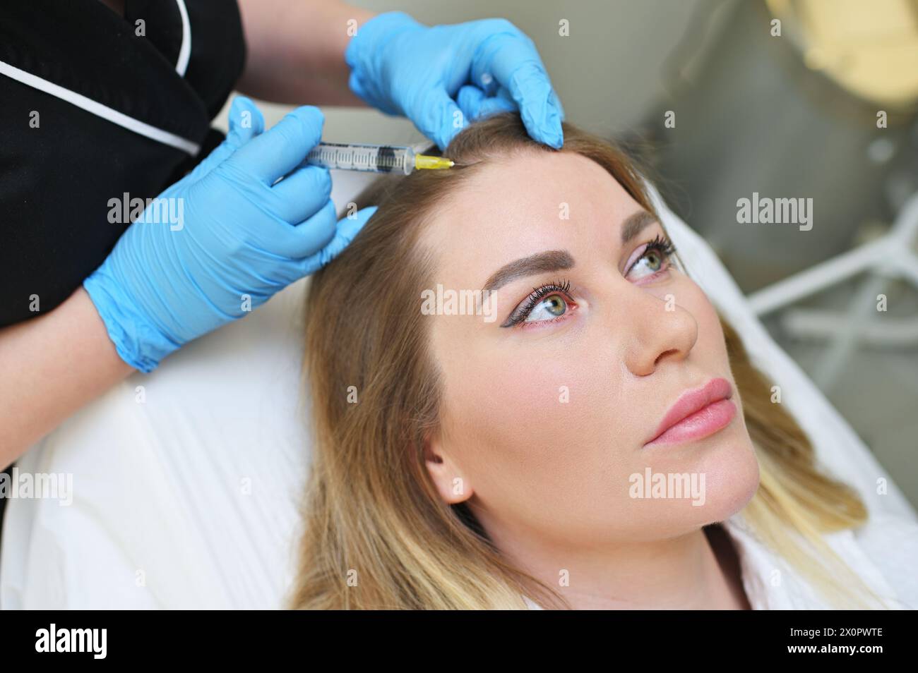 dermatologist cosmetologist performs a mesotherapy procedure and ...