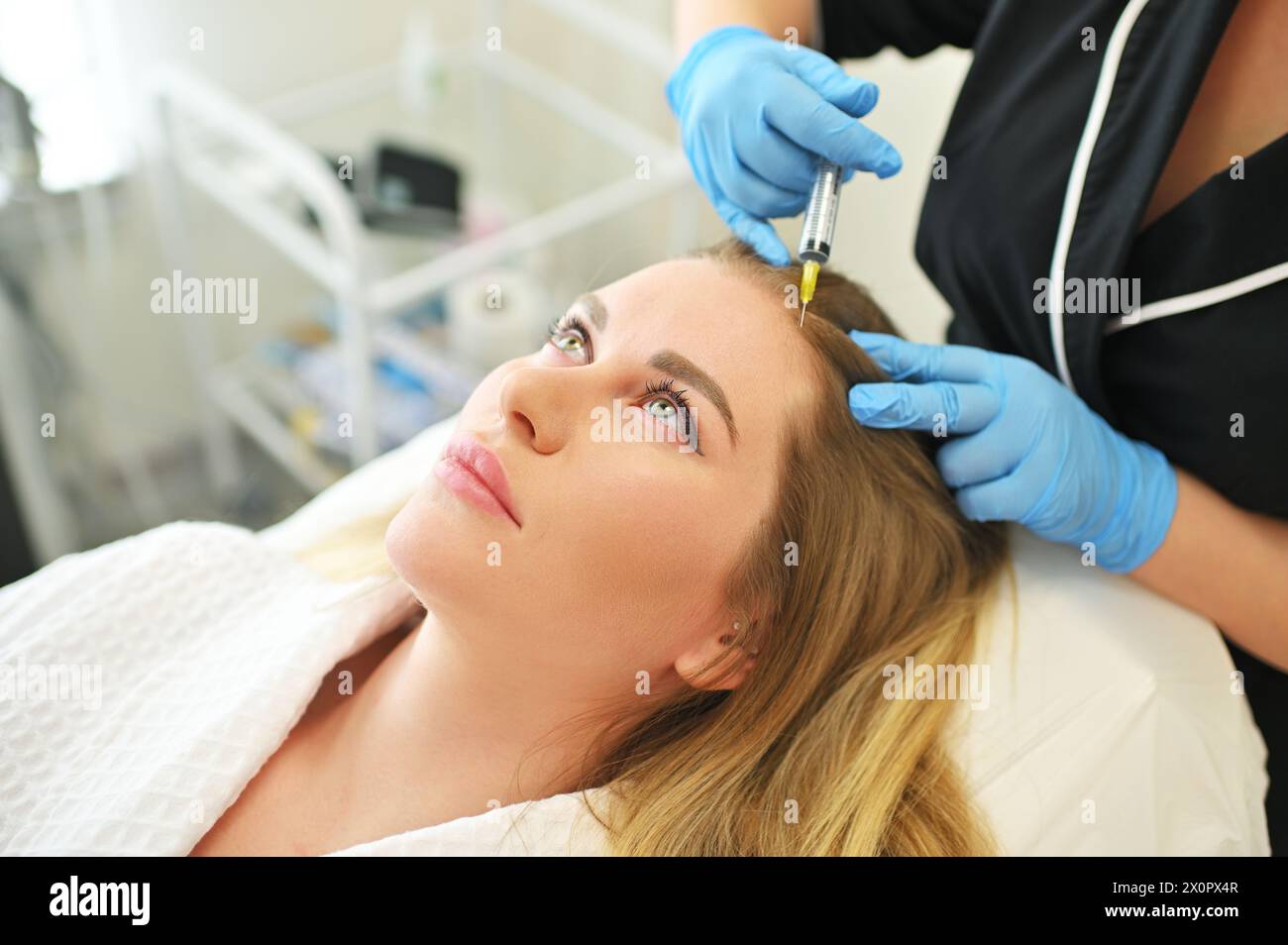 dermatologist cosmetologist performs a mesotherapy procedure and ...