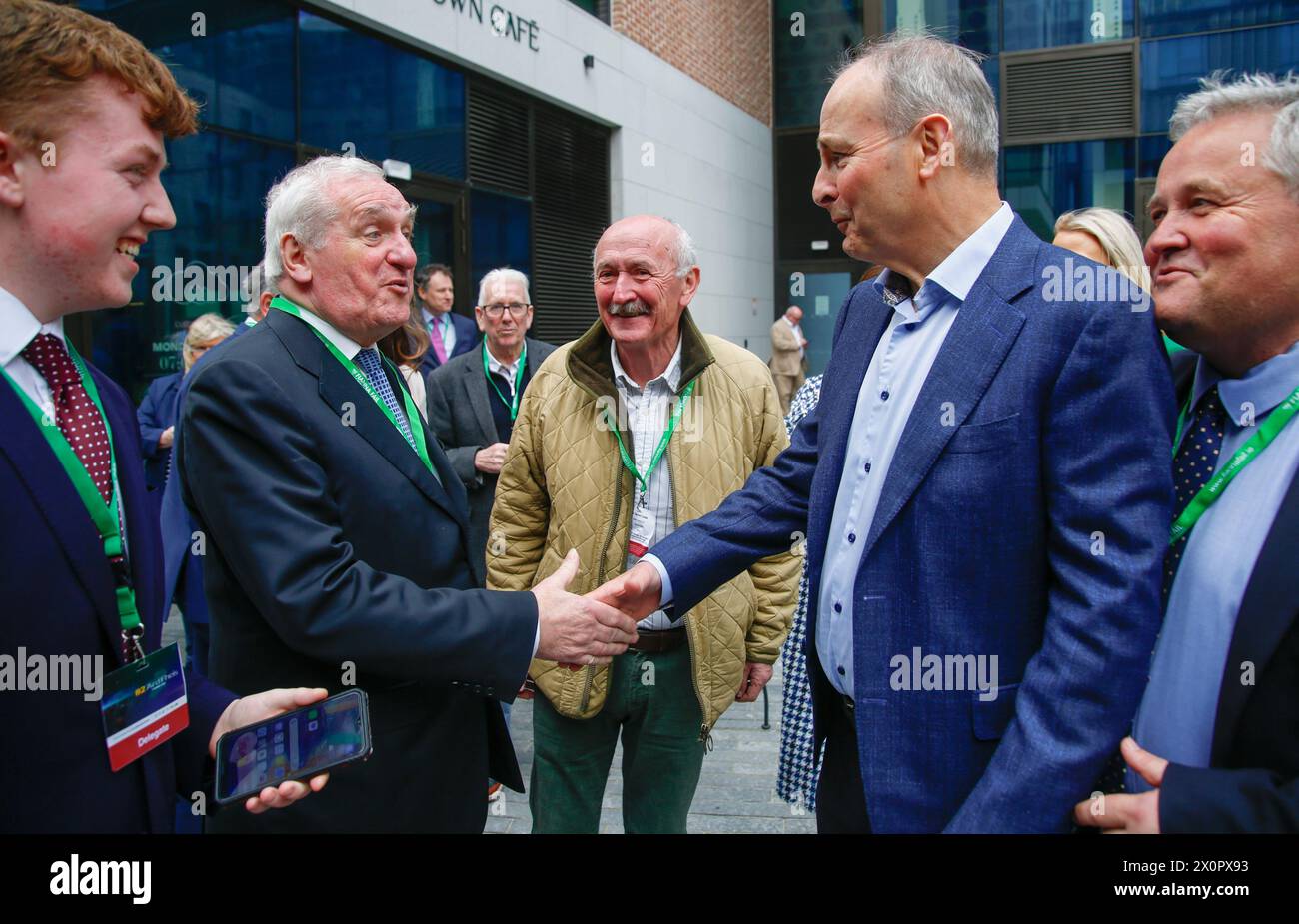 Former Taoiseach Bertie Ahern meets and shakes hands with current Fianna Fail leader and ...