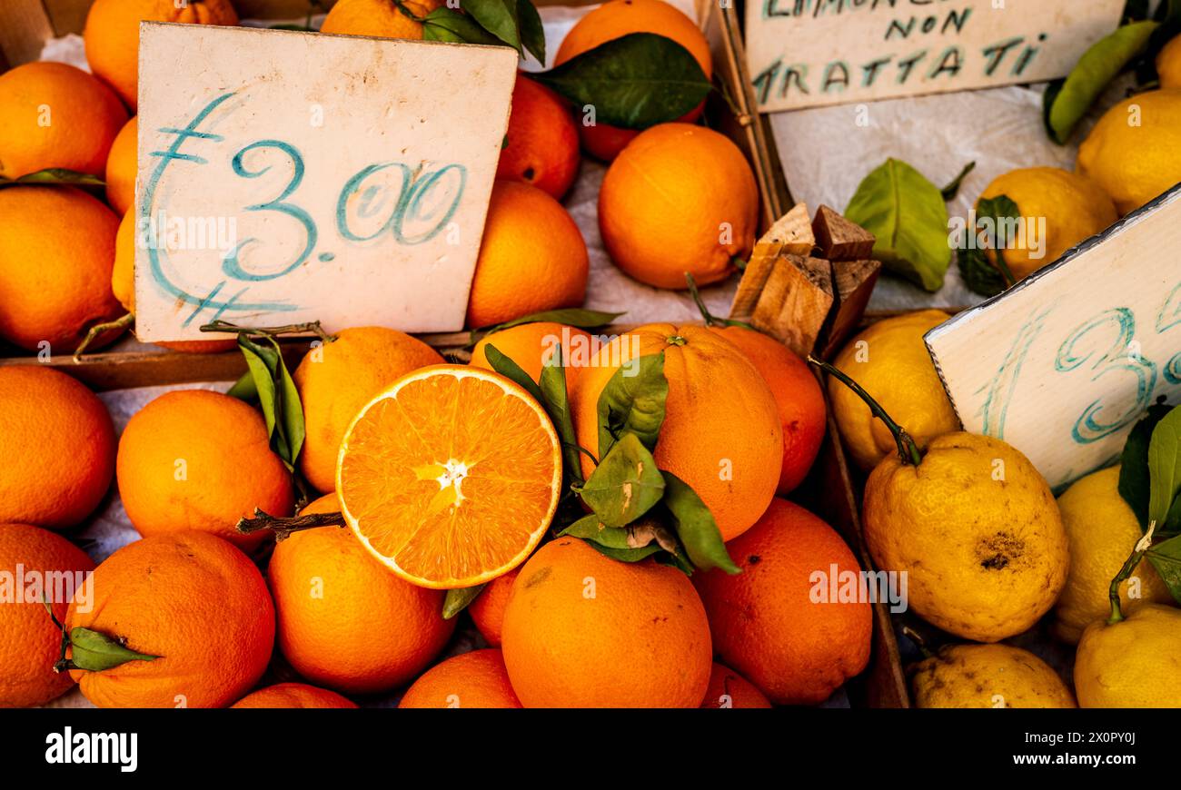 Fresh oranges for sale at a fruit and vegetable market stall in ...