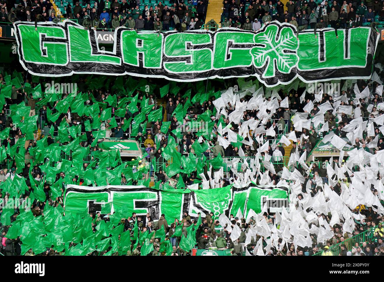 Celtic fans wave flags and display banners in the stands during the ...