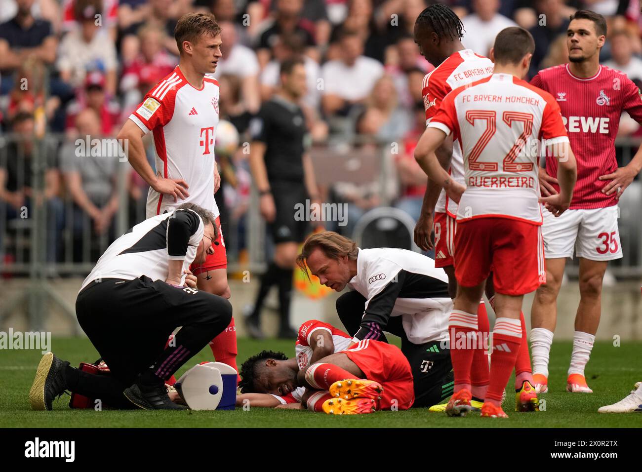 Injured Bayern's Kingsley Coman grimaces in pain during the German ...