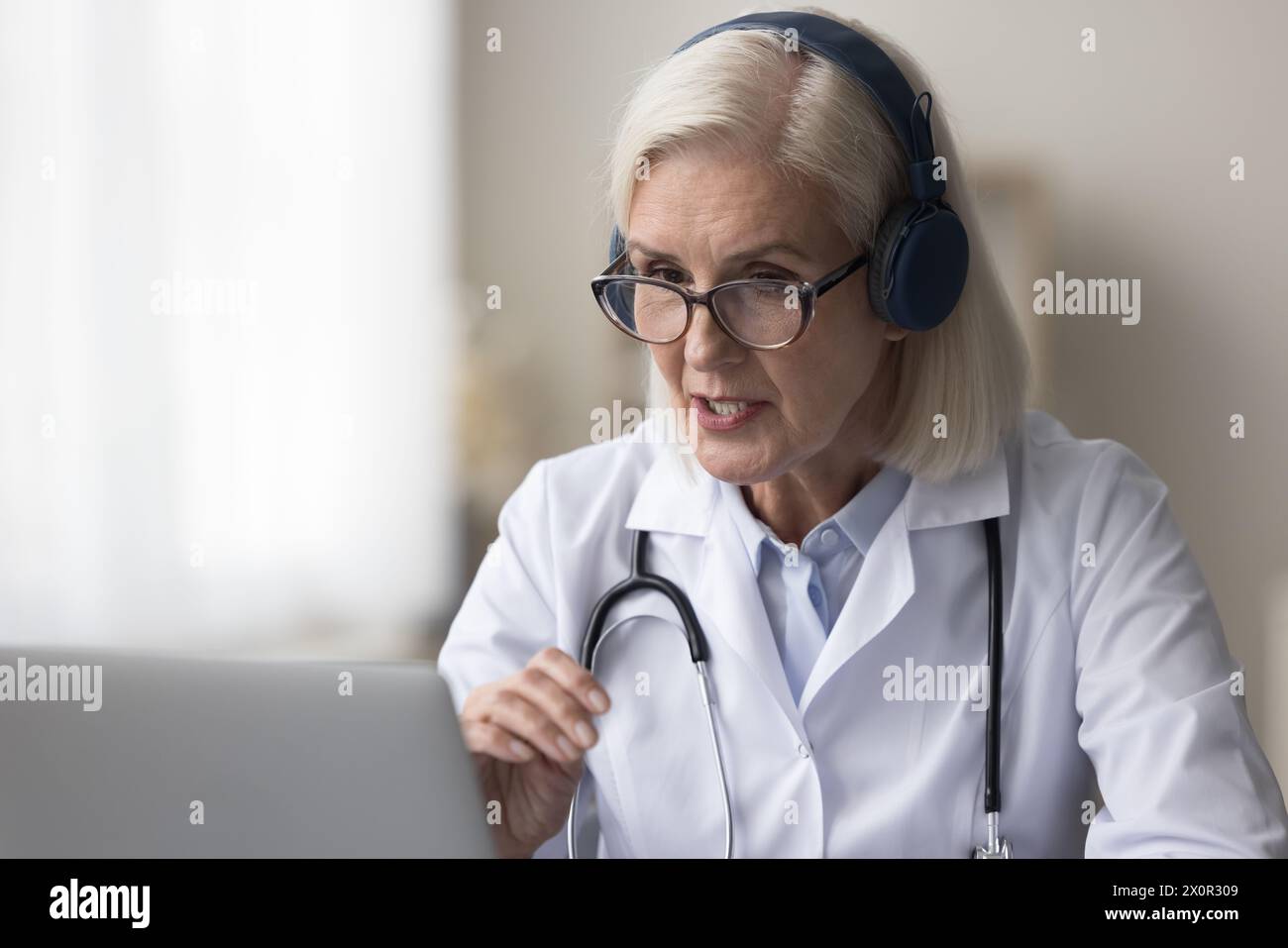Aged therapist using video call app, conduct virtual consultation Stock ...