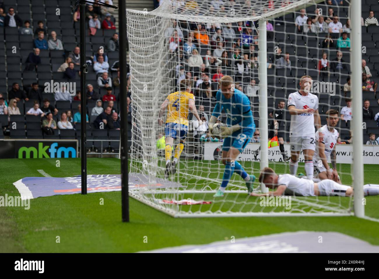 Elliott Hewitt celebrates after scoring for Mansfield Town, and ...