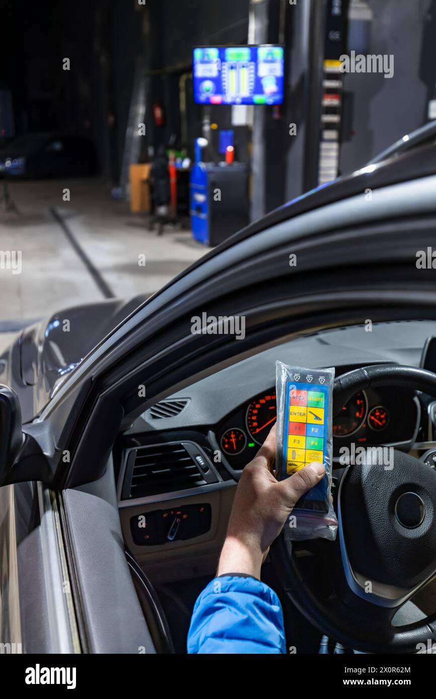 Get a glimpse of automotive expertise as a mechanic inside a car ...