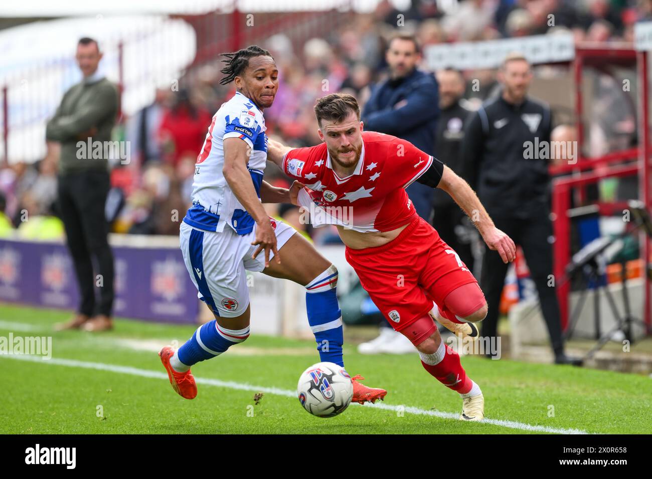 Nicky Cadden of Barnsley and Kelvin Abrefa of Reading battle for the ...