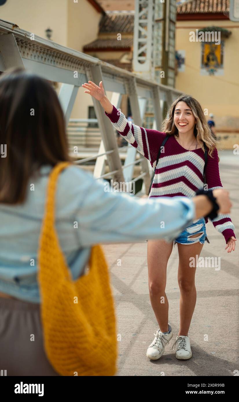Two friends hug greet hi-res stock photography and images - Alamy