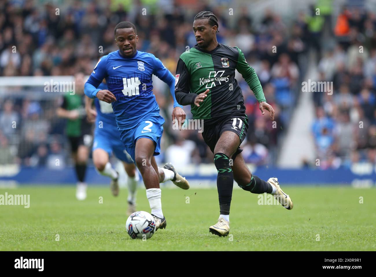 Coventry City's Haji Wright (right) and Birmingham City's Ethan Laird ...