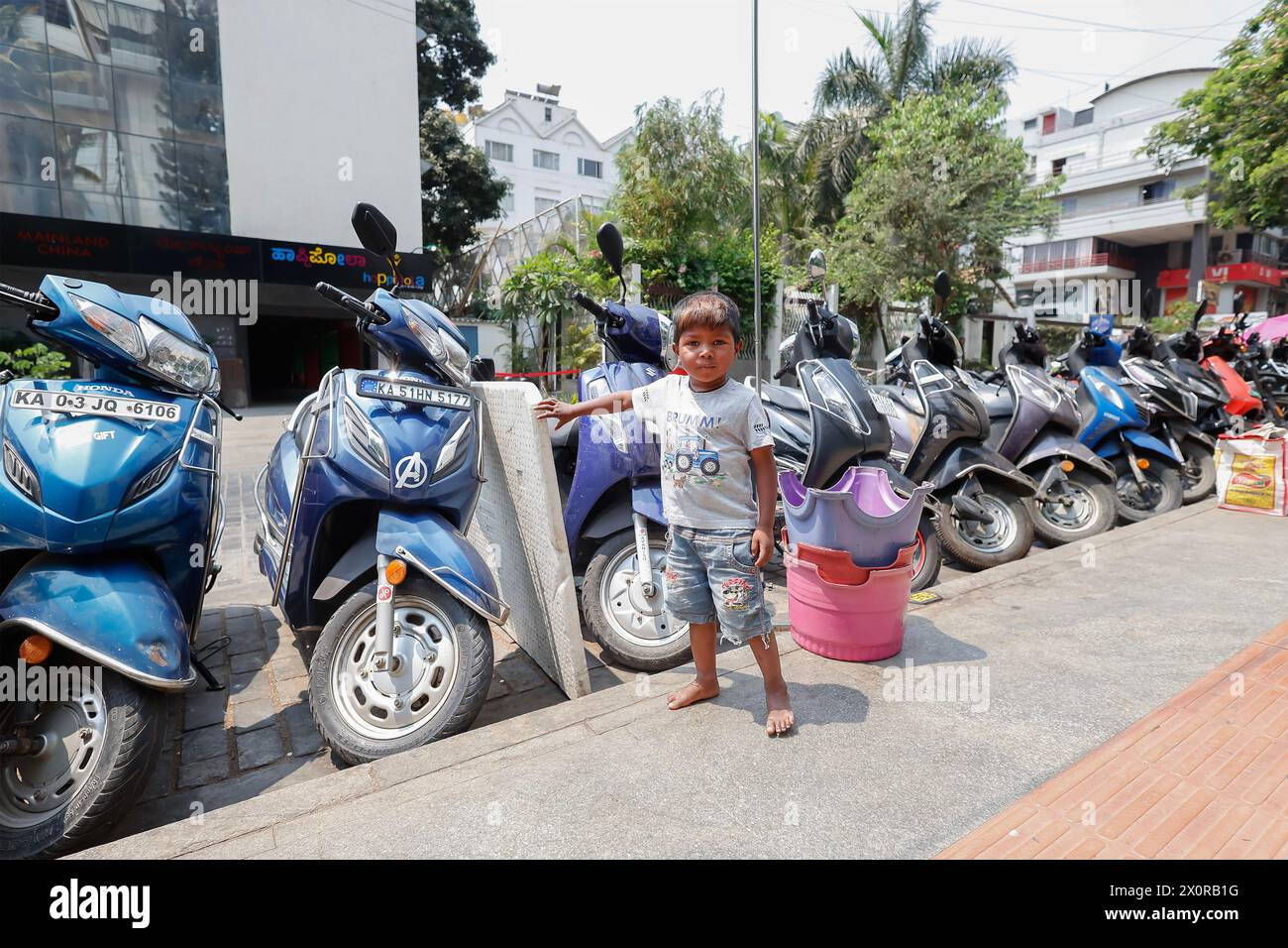 Indian boy on moped in street india hi-res stock photography and images ...