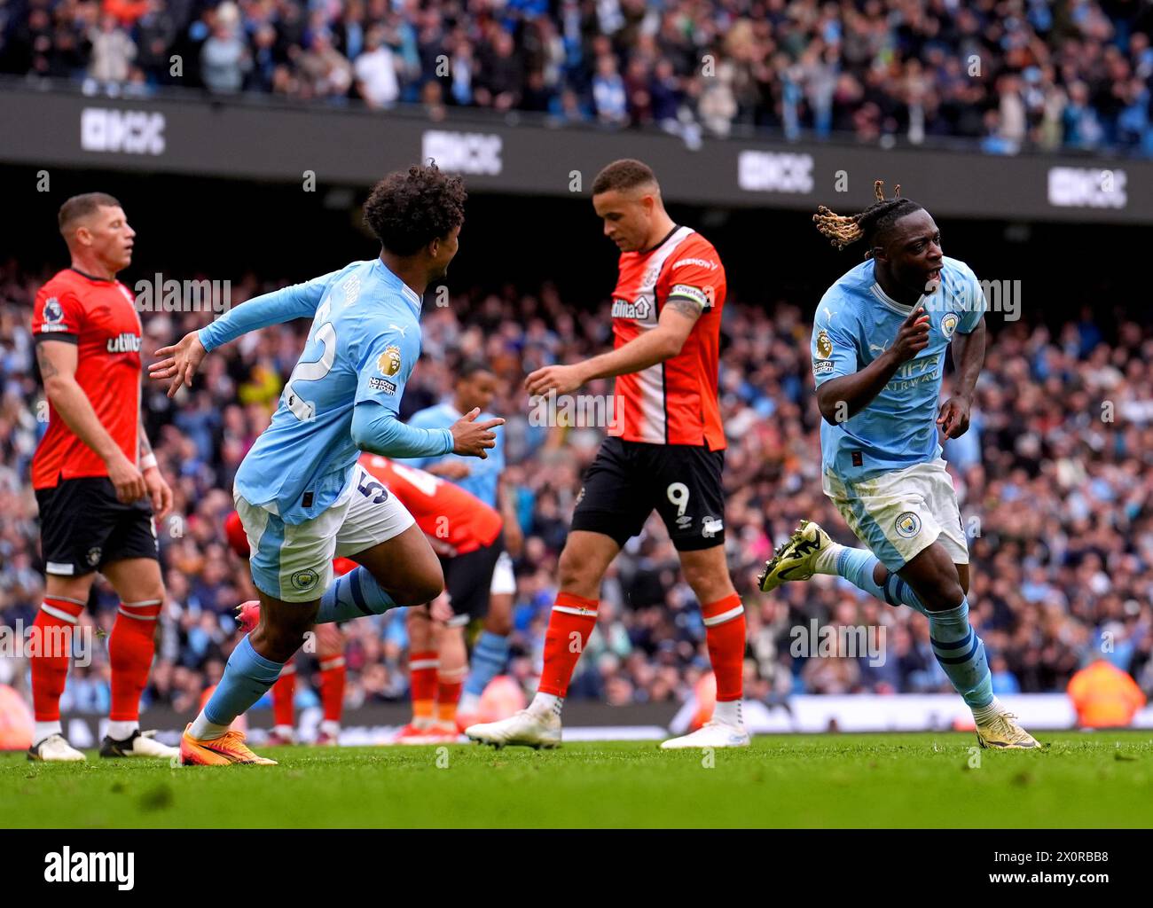 Manchester City's Jeremy Doku celebrates scoring their side's fourth ...