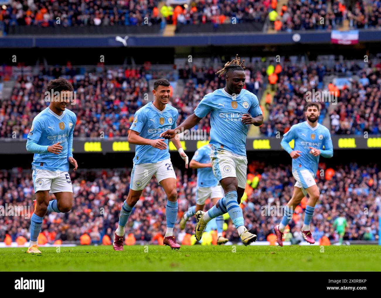 Manchester City's Jeremy Doku celebrates scoring their side's fourth ...