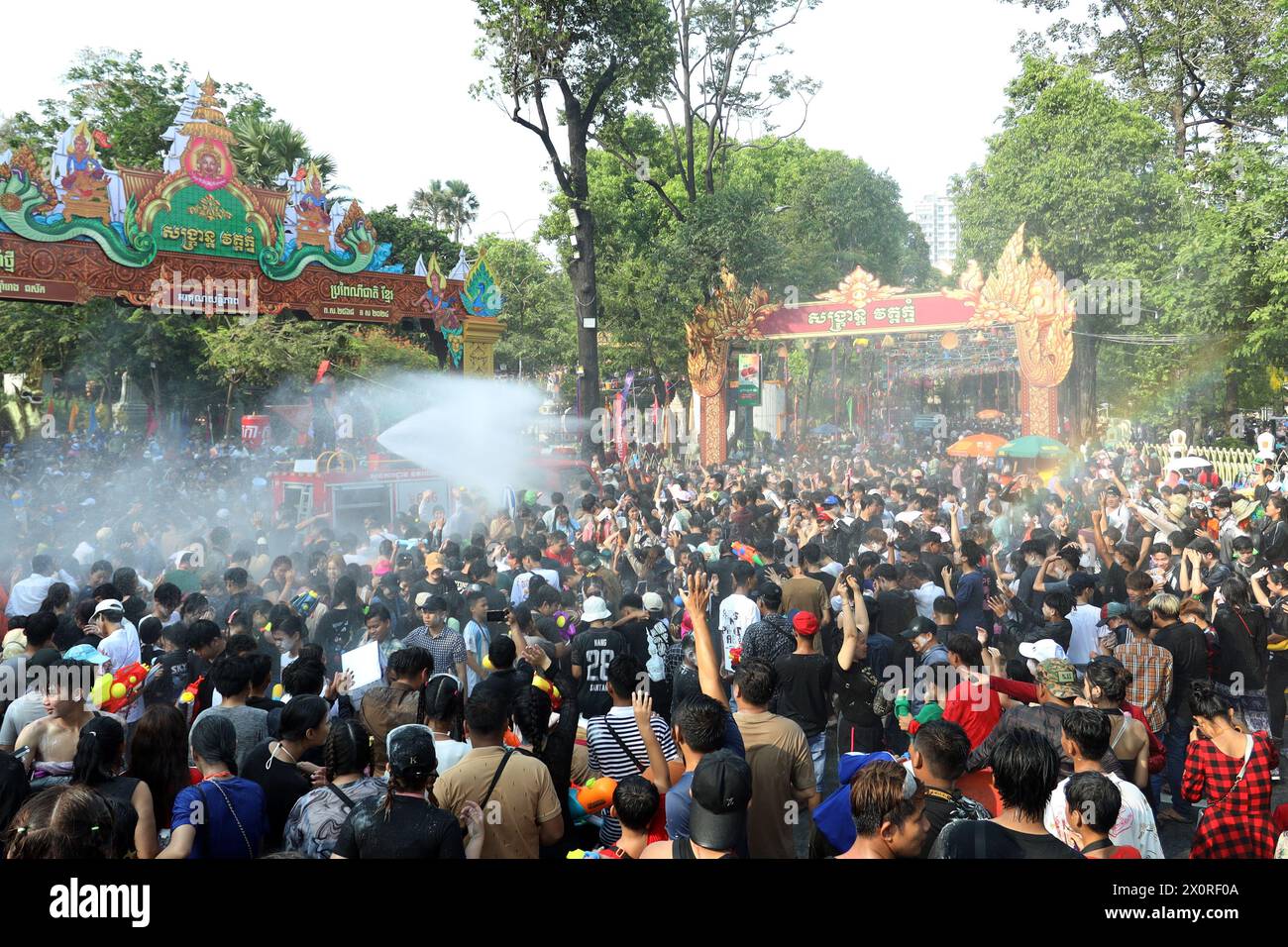 Phnom Penh, Cambodia. 13th Apr, 2024. People splash water on one another in celebration of the ...