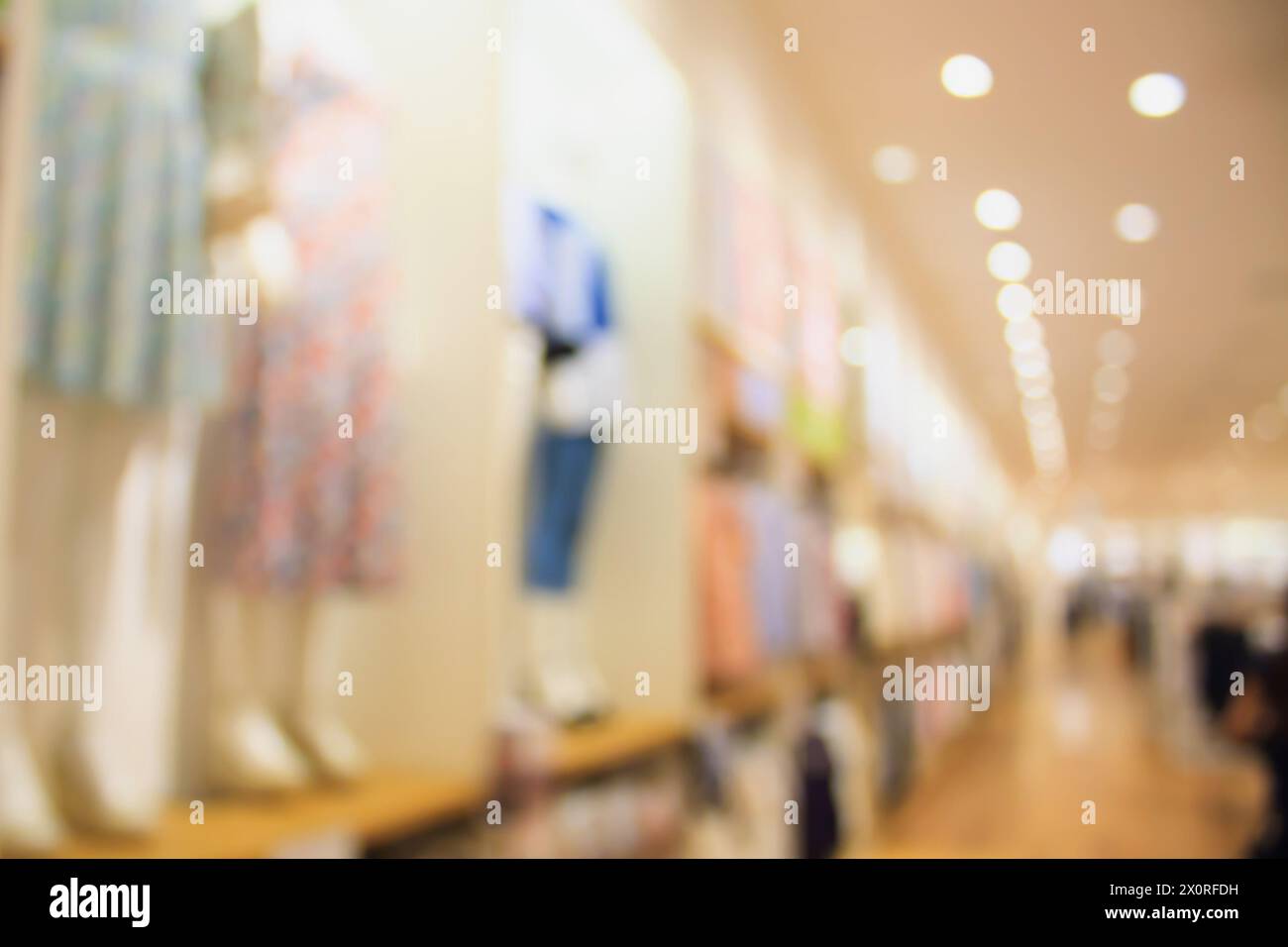 clothing boutique store interior blurred background Stock Photo - Alamy