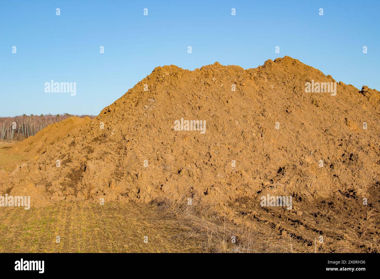 A pile of land in the field, the preparation of a sandpit Stock Photo ...