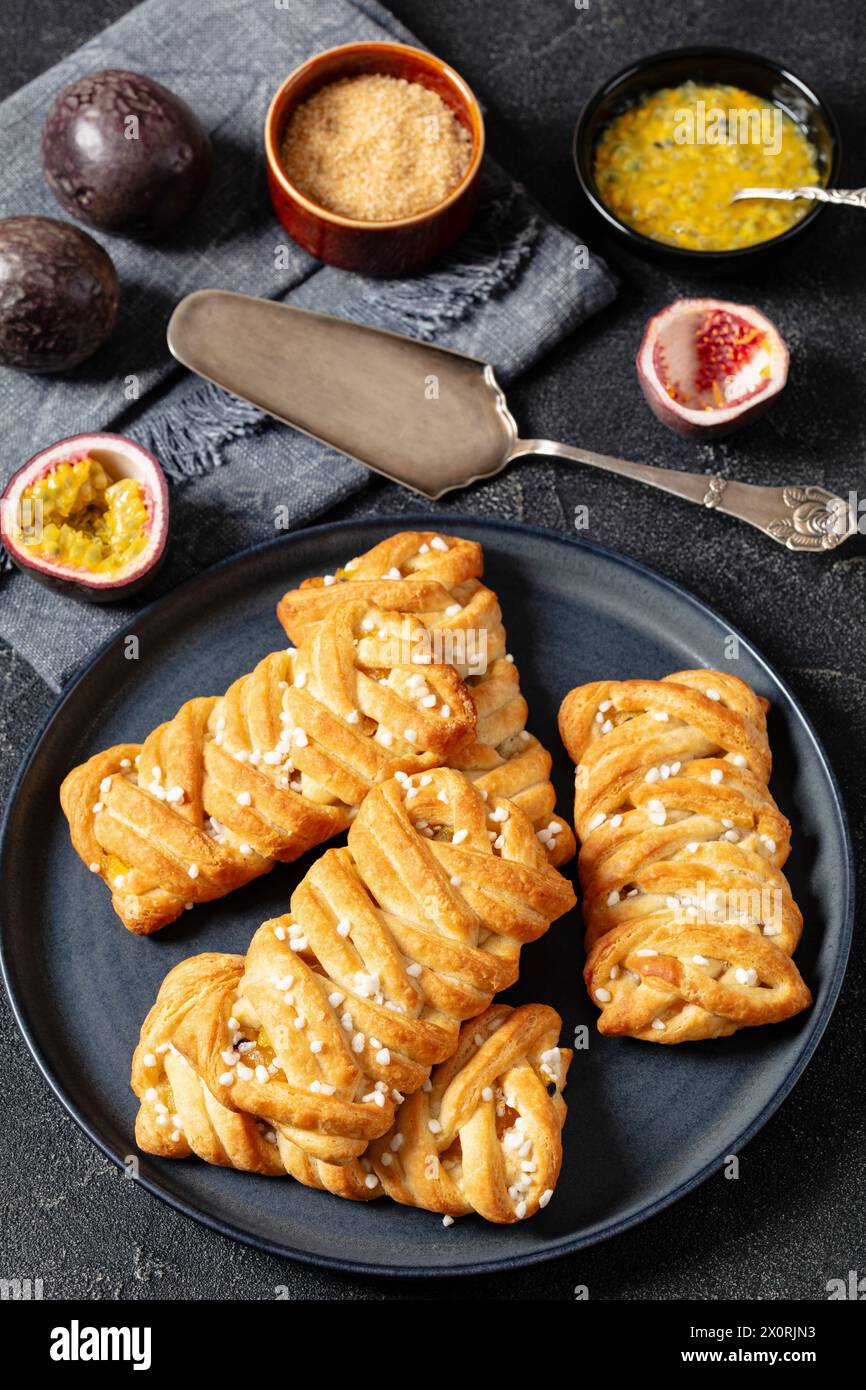 passion fruit puff pastry turnovers pies on plate on concrete table ...