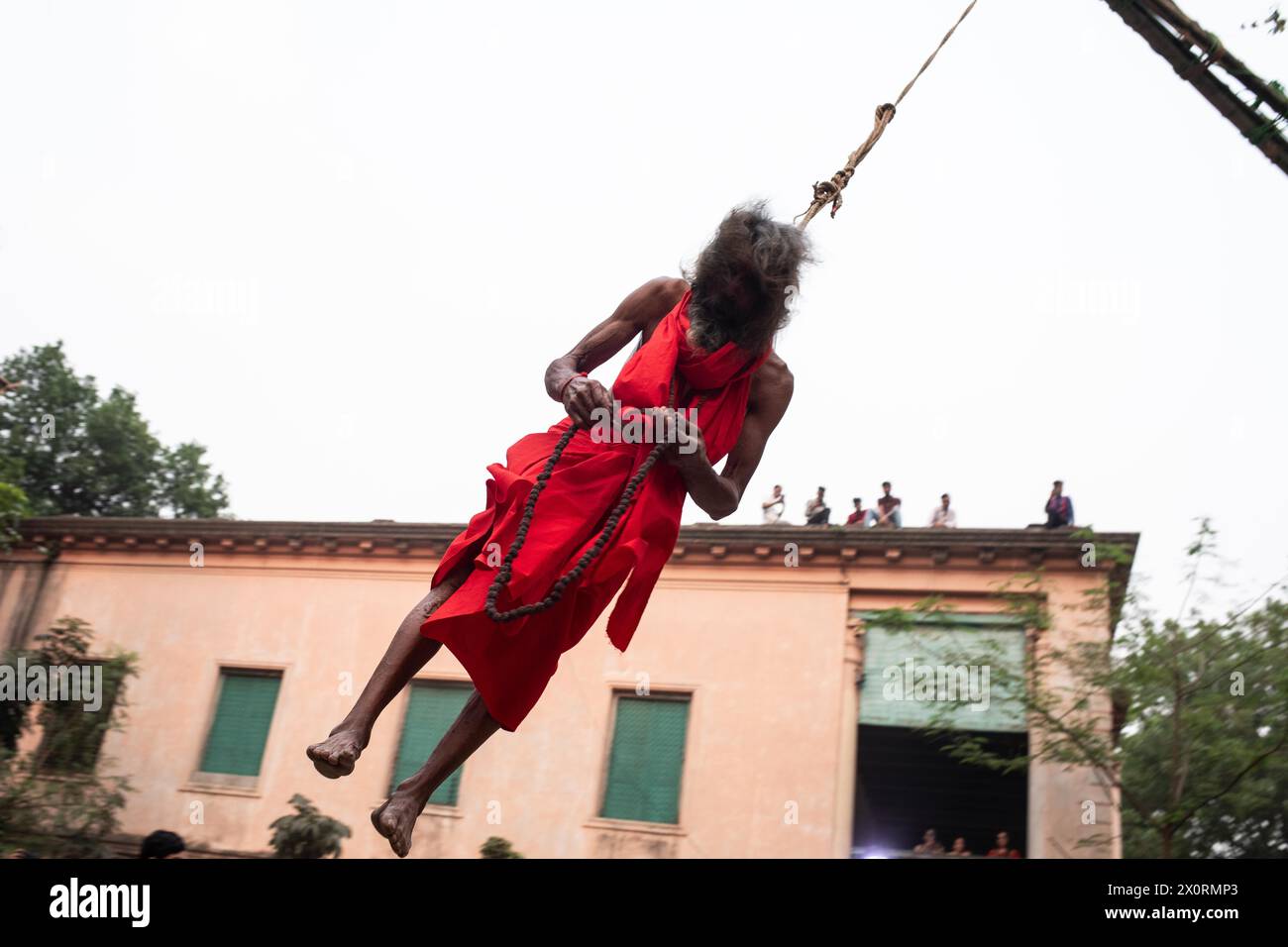 Dhaka, Bangladesh. 13th Apr, 2024. A devotee tied with a hook on his ...