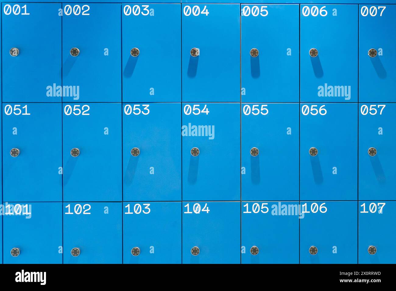Row of blue lockers with number locks Stock Photo - Alamy