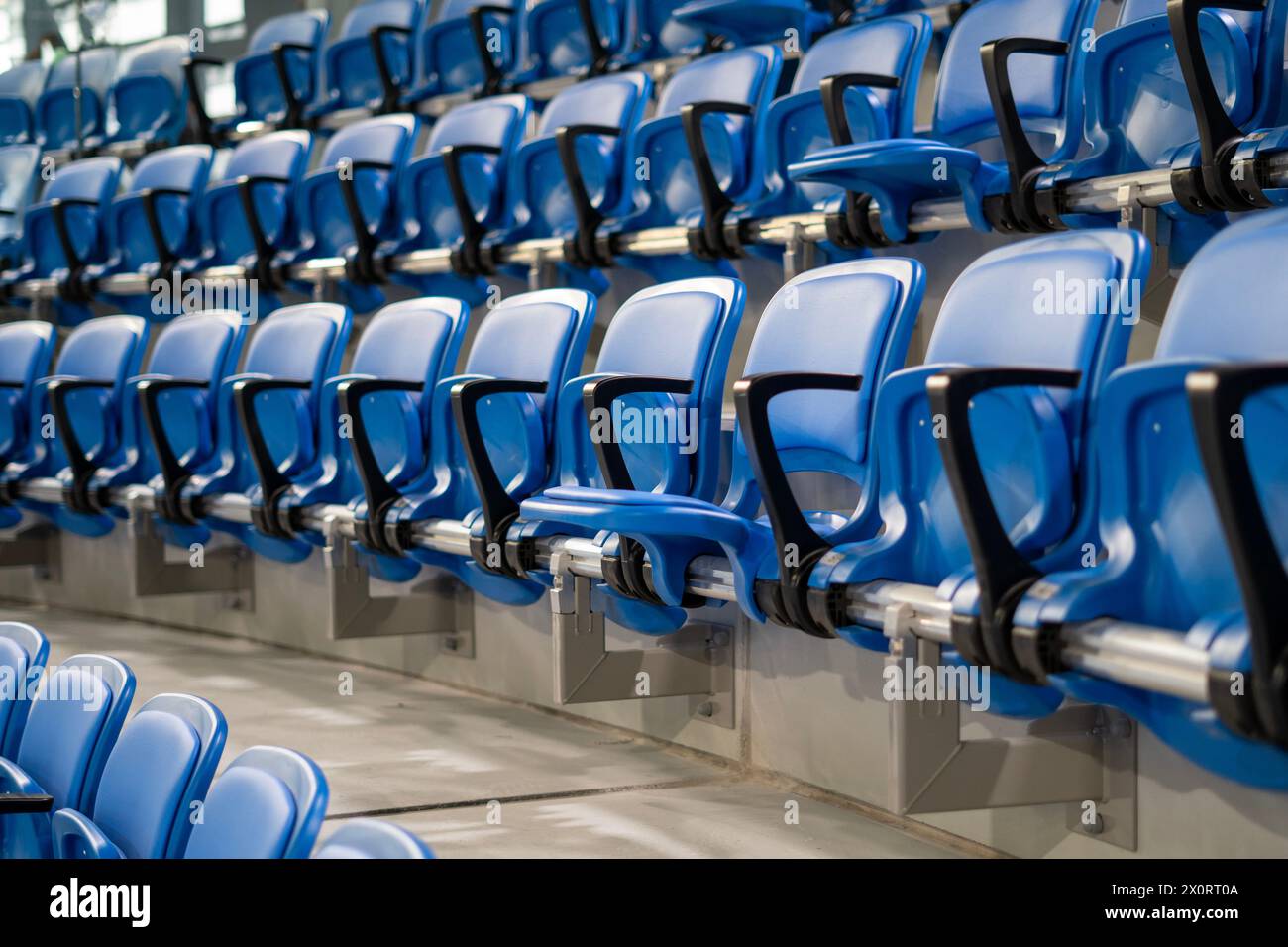 A long row of modern blue chairs with folding seats in a room Stock ...