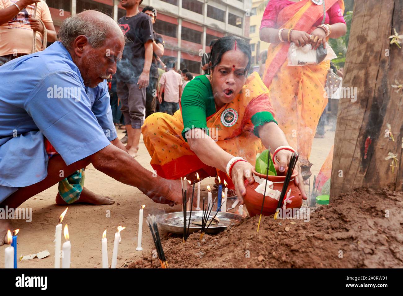 Hindu people perform rituals during the Charak Puja festival on the ...