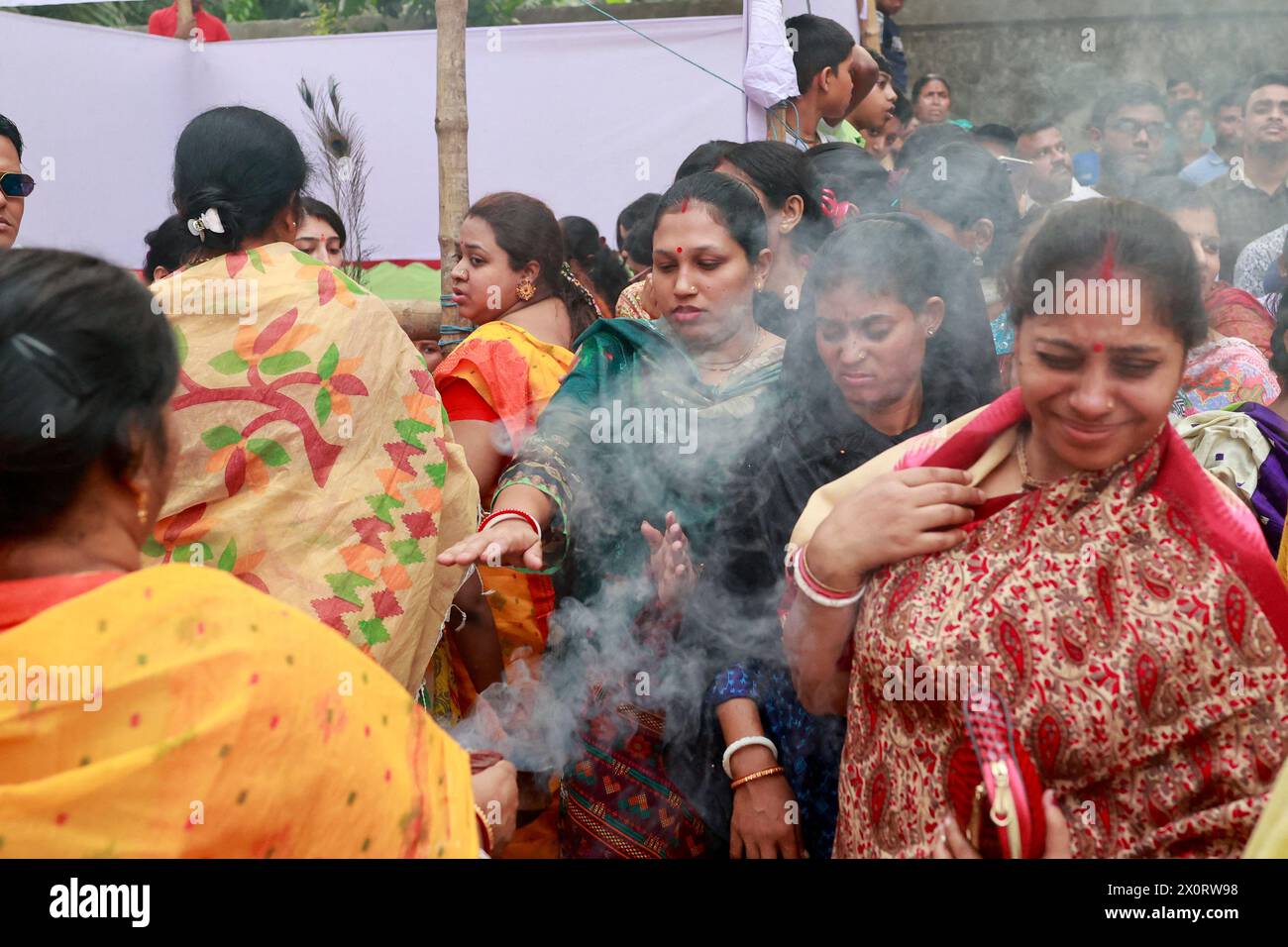 Hindu people perform rituals during the Charak Puja festival on the ...
