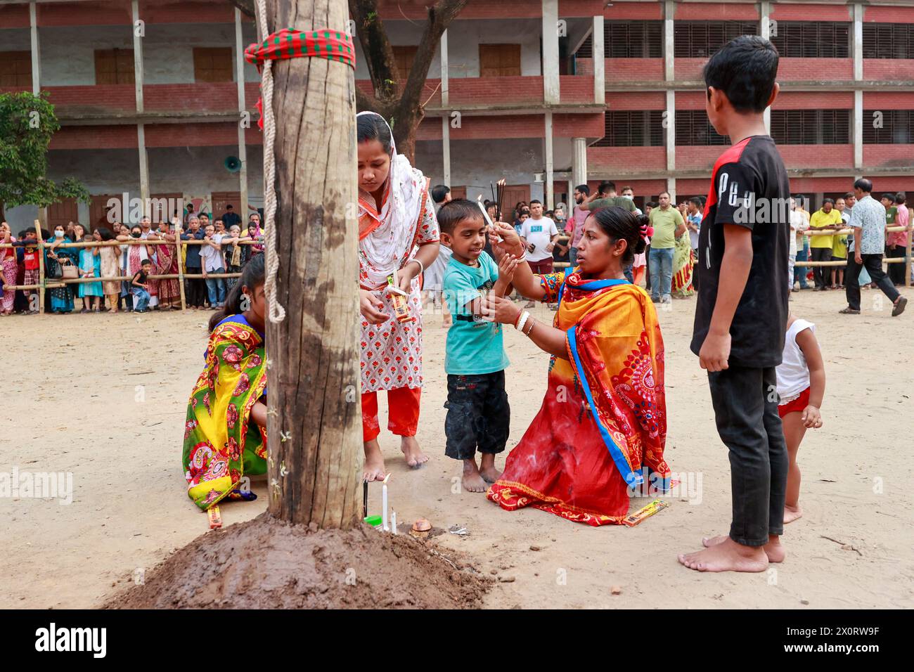 Hindu people perform rituals during the Charak Puja festival on the ...