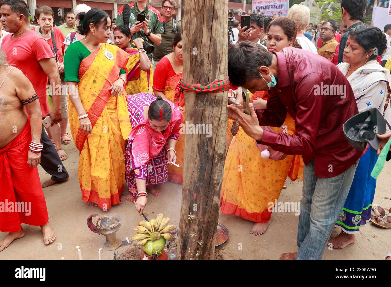Hindu people perform rituals during the Charak Puja festival on the ...