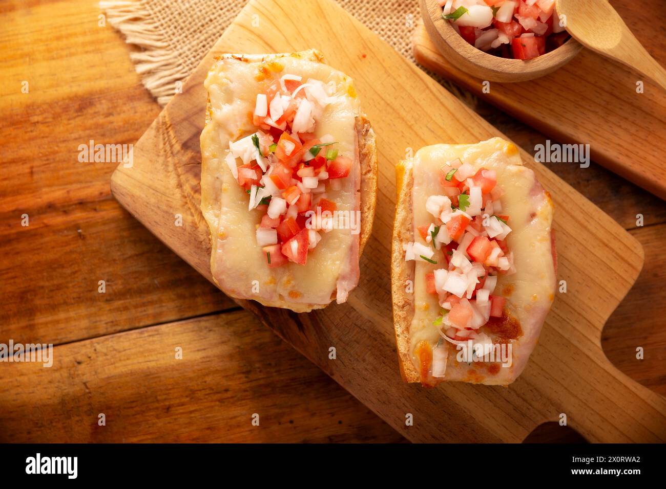 Molletes. Mexican recipe based on bolillo bread split lengthwise ...