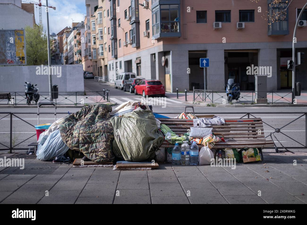 Urban Scene with the Improvised Home of a Homeless Beggar on a Bench in ...