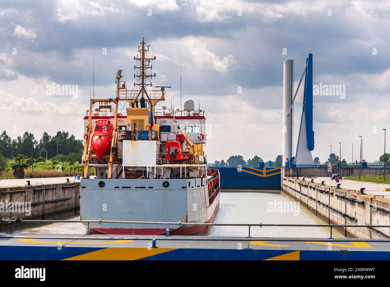 Merchant ship inside the Seville lock waiting for the opening of the ...