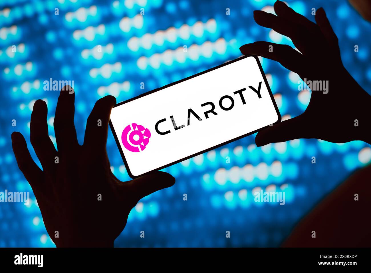 In this photo illustration, the Claroty logo is displayed on a ...