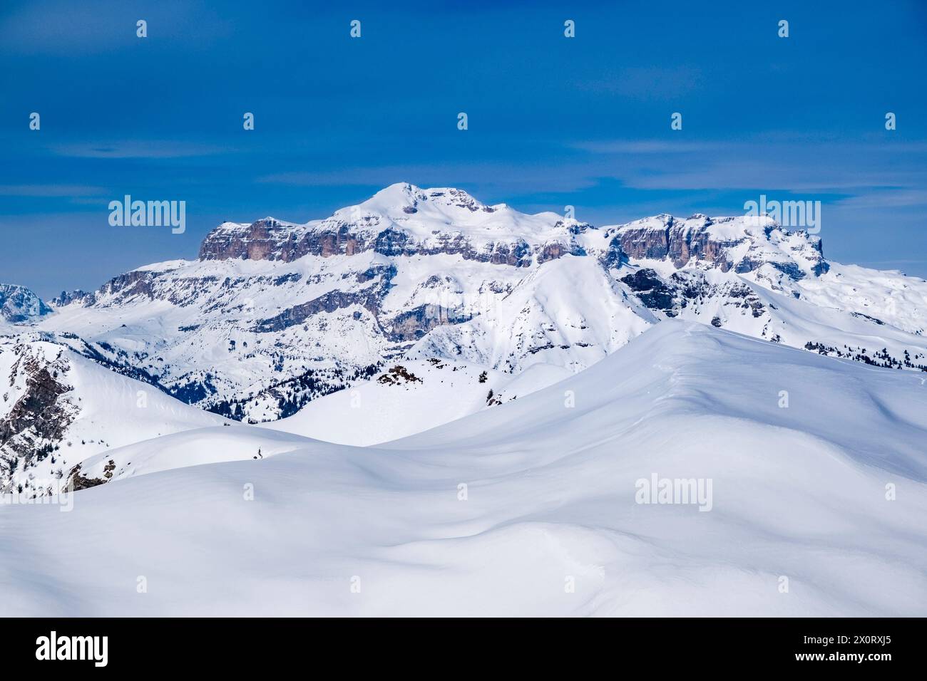 Snow-covered slopes of alpine Dolomite landscape around Giau pass in ...