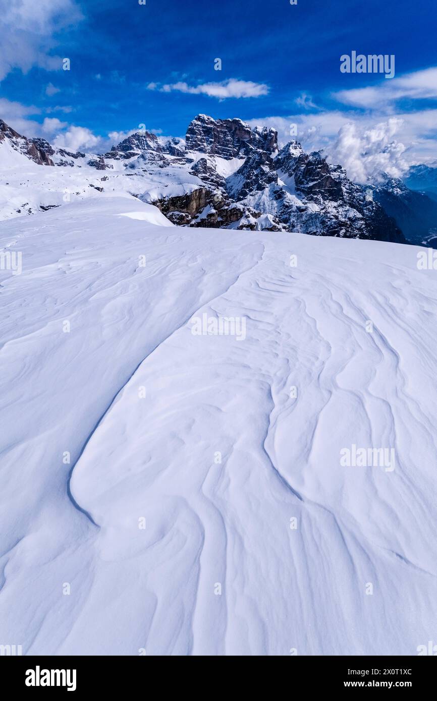 Snowdrift creating artful structures in Tre Cime Natural Park in winter ...