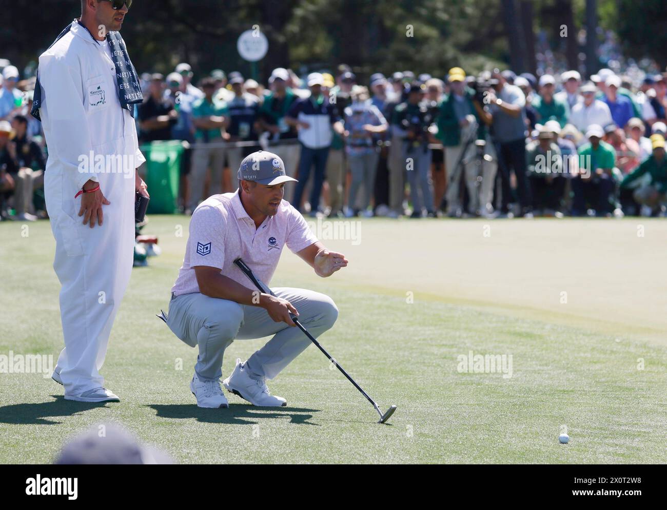 Augusta, United States. 13th Apr, 2024. Bryson DeChambeau lines up a ...