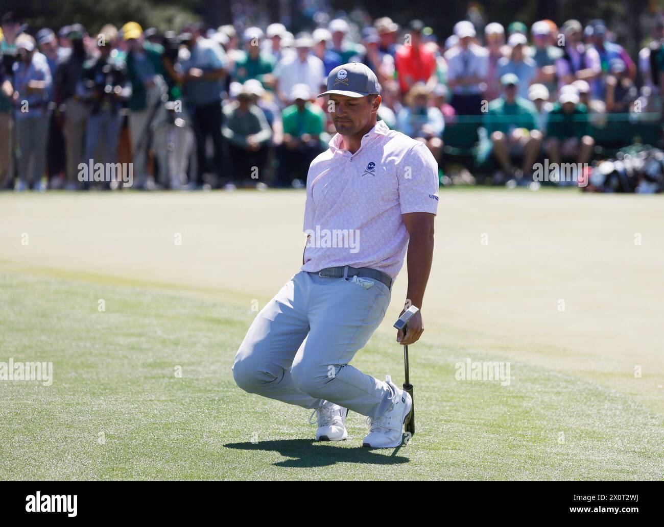 Augusta, United States. 13th Apr, 2024. Bryson DeChambeau reacts after ...