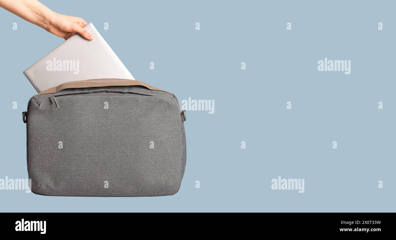 Hand putting laptop notebook into computer bag. Banner background Stock ...