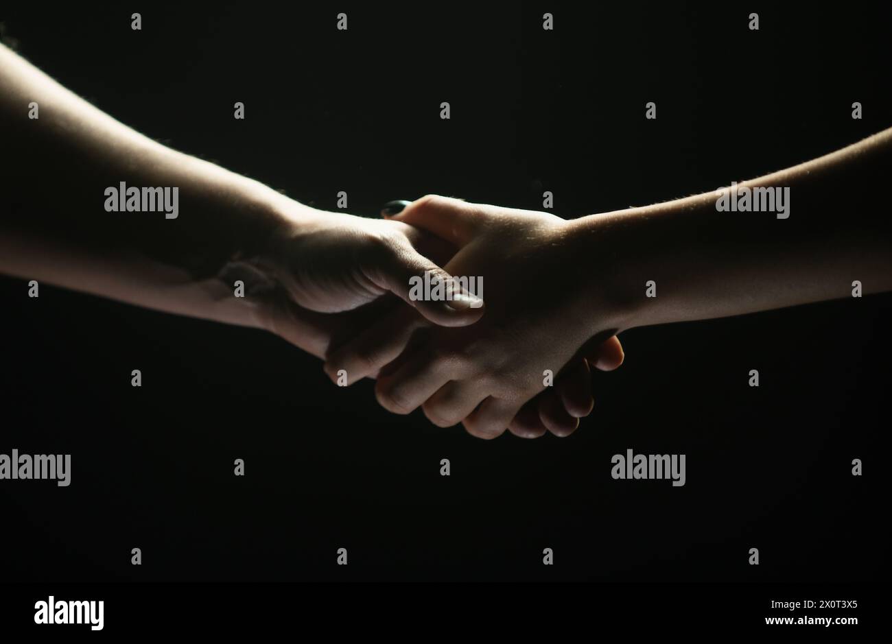 Hands gesturing on black background. Giving a helping hand. Support and ...