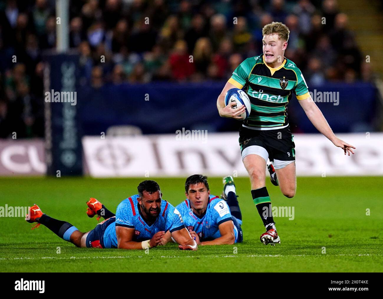 Northampton Saints' Fin Smith avoids being tackled during the Investec ...