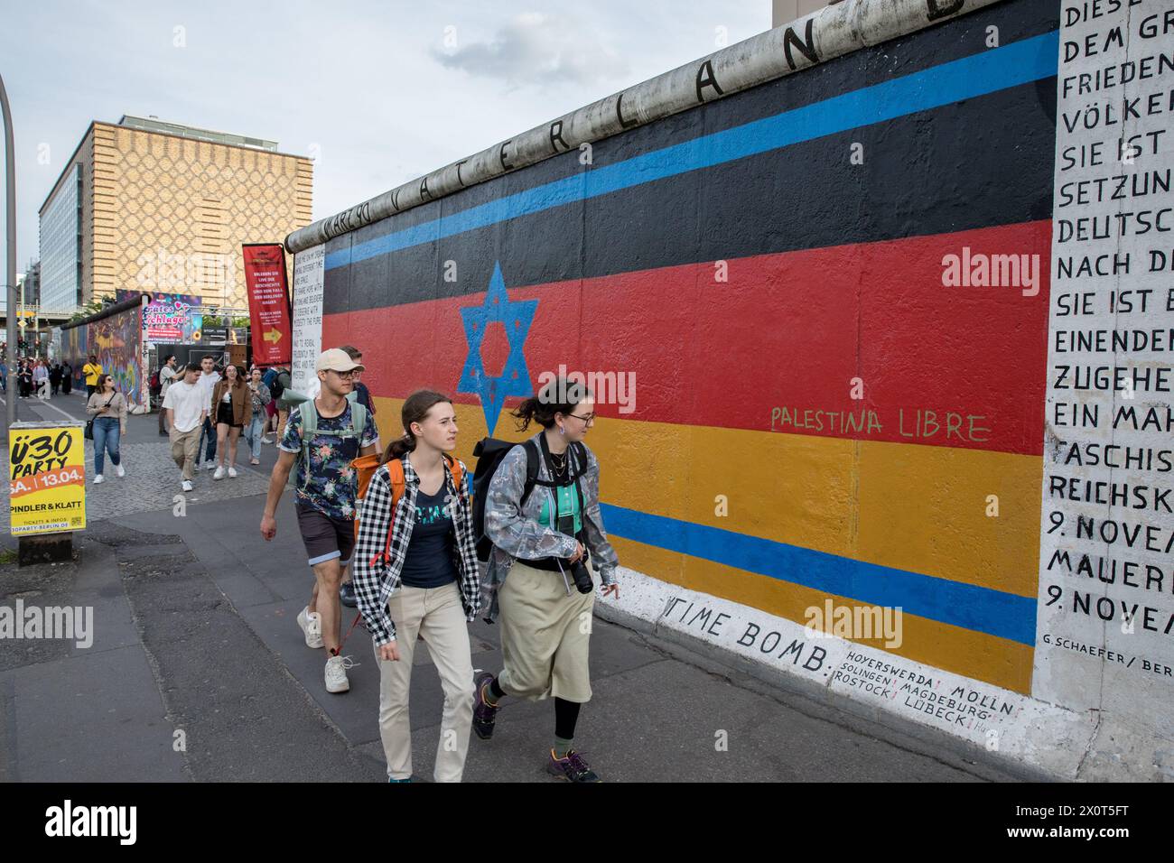 April 13, 2024, Berlin, Germany: Onlookers observe and capture photos ...