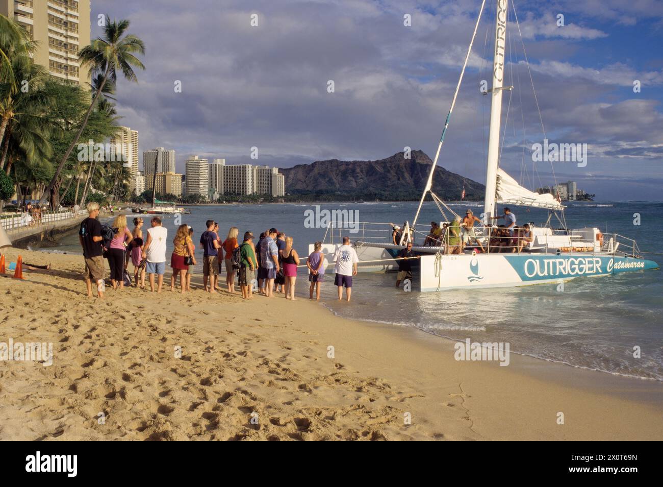 Oahu, Hawaii, USA - Tourists Lining up for Catamaran Ride, Waikiki ...