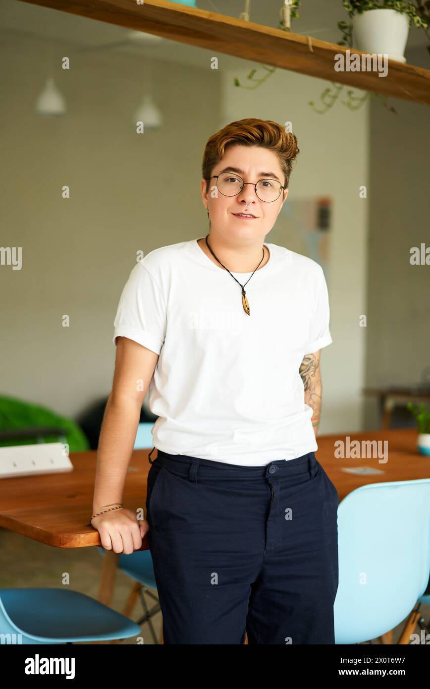 Transgender professional stands confidently in office, showcasing ...