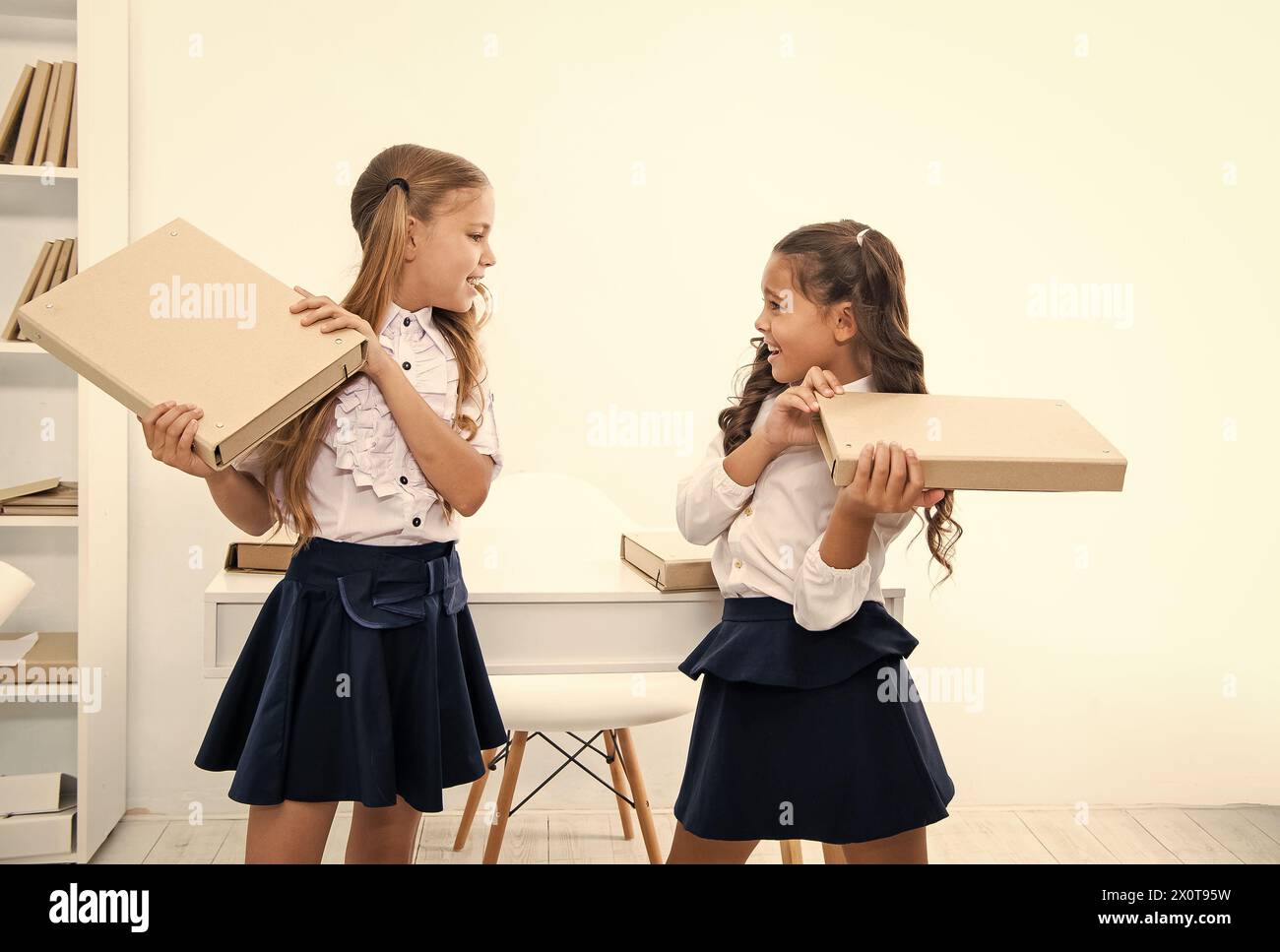 ready for school lesson. two girls in school class. education and ...
